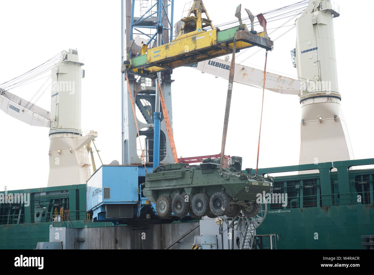 A U.S. Army Stryker Infantry Vehicle – Dragoon descends at the port of ...