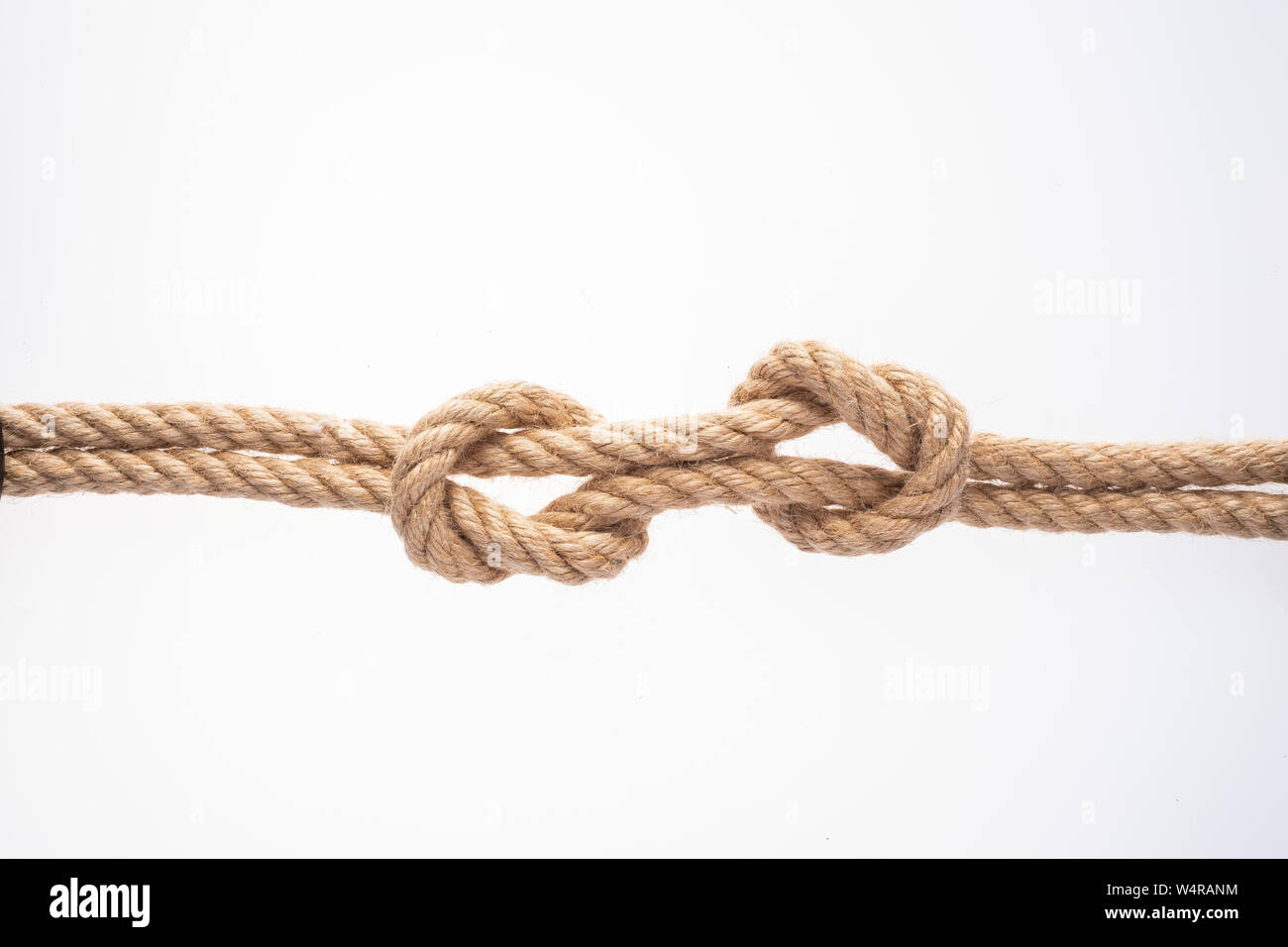 Fishing node on white background. Nautical rope knot Stock Photo - Alamy