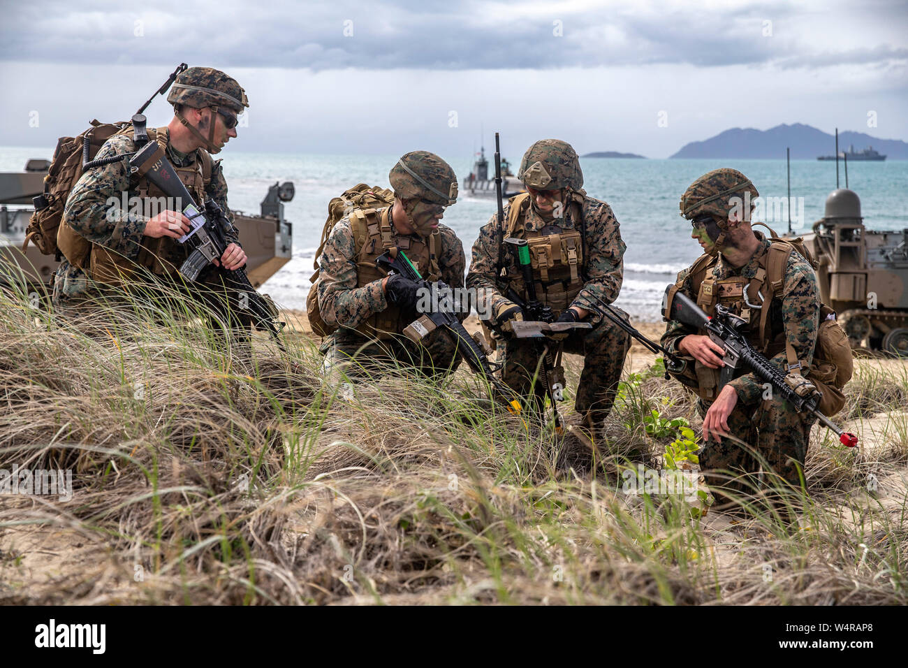 U.S. Marines assess a terrain map during a simulated amphibious assault ...