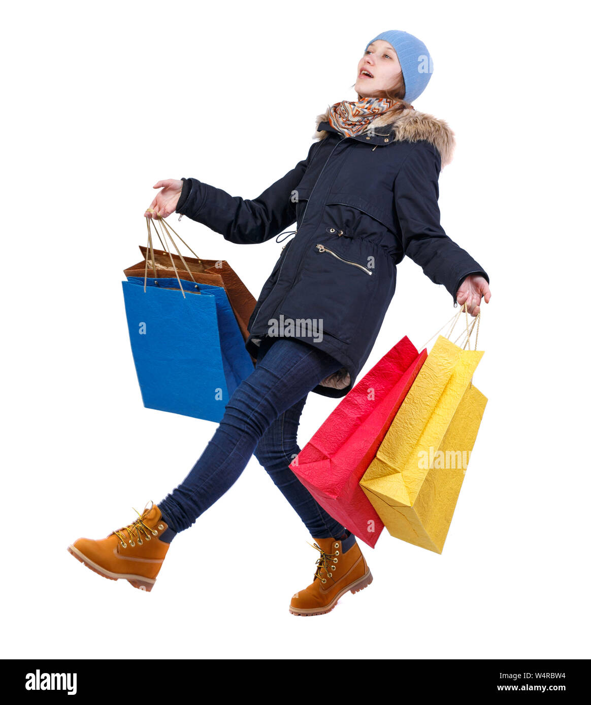 Falling woman with shopping bags. beautiful girl in motion. backside ...