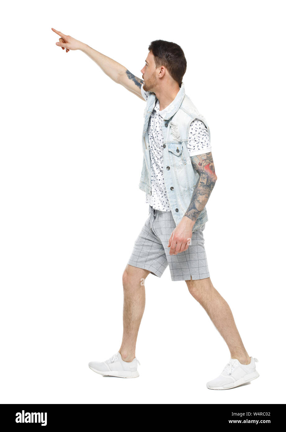 Side view of a man walking with a pointing hand. going guy showing ...