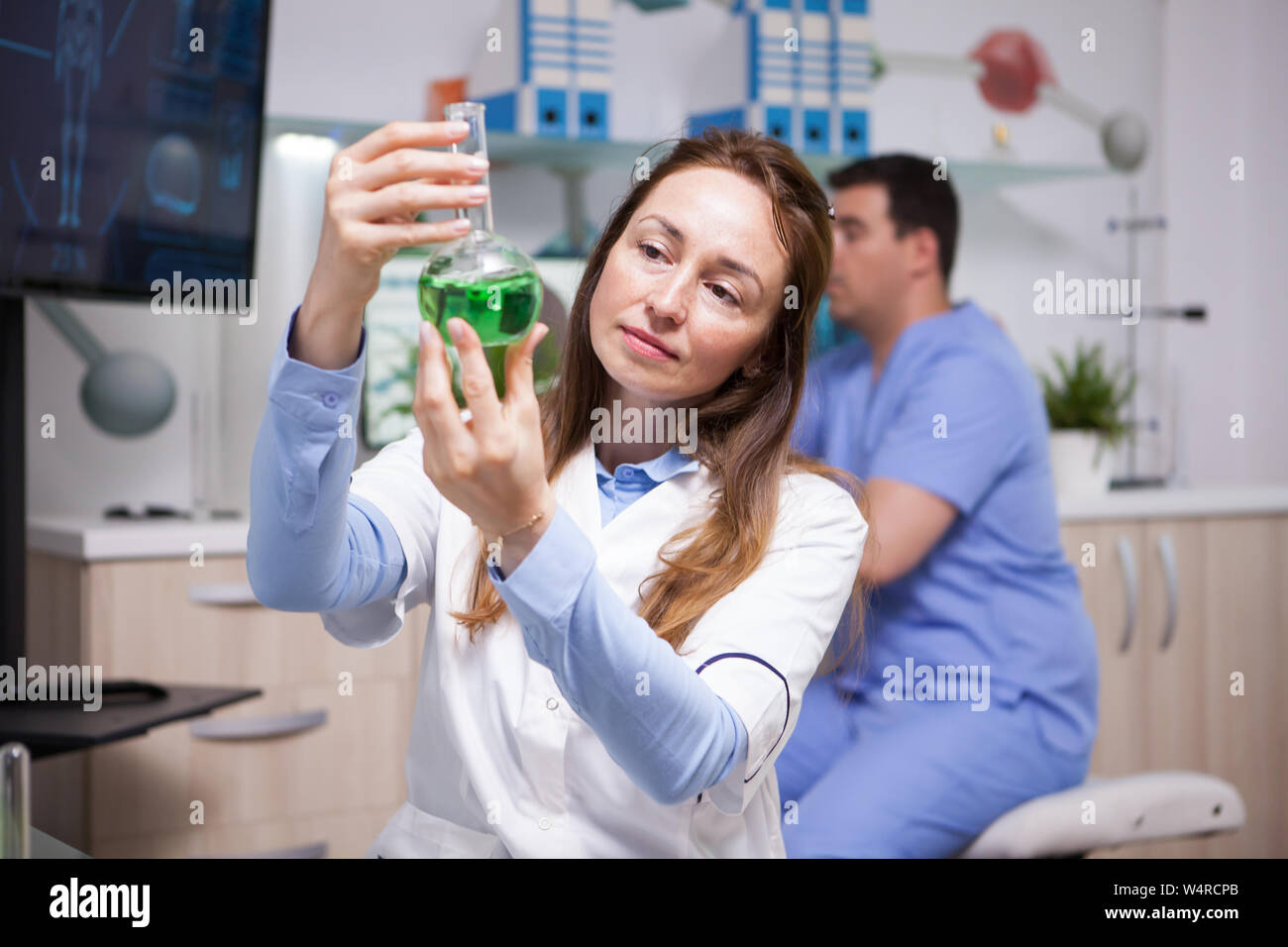 Middle age scientist doing research on plants for agriculture industy ...