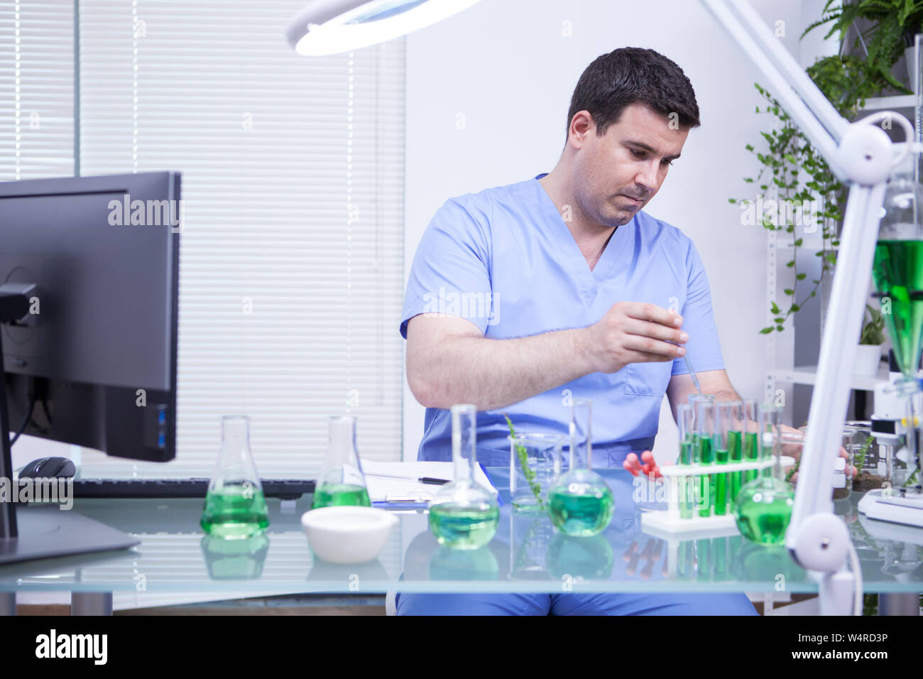 Taking a sample biologist hi-res stock photography and images - Alamy