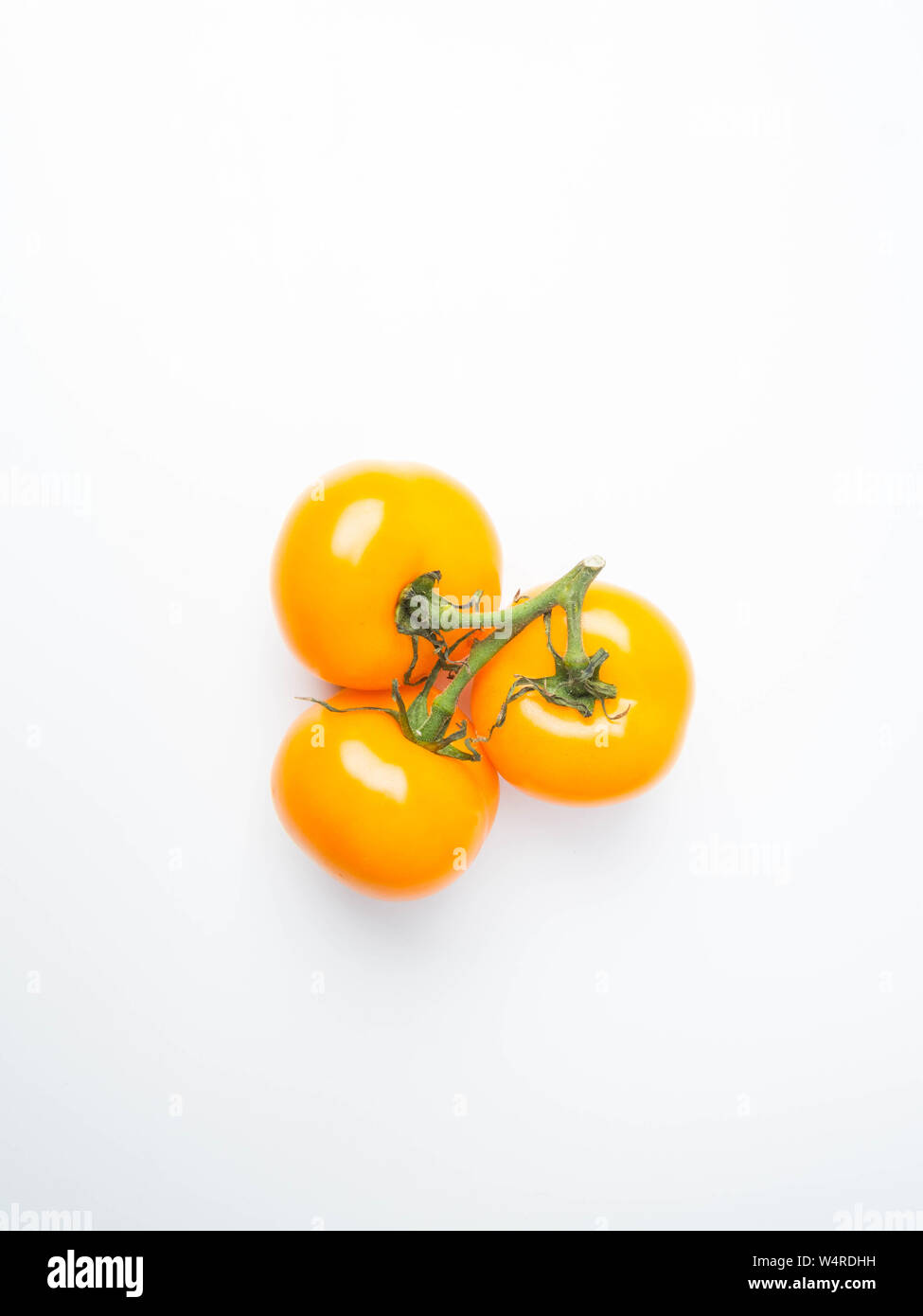 fresh yellow tomatoes on white background with copy space Stock Photo ...