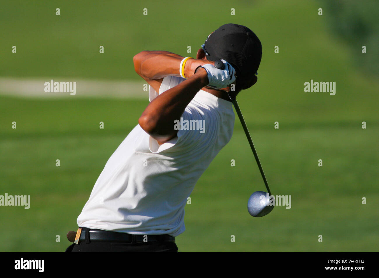 man golfer in action on a golf course Stock Photo - Alamy