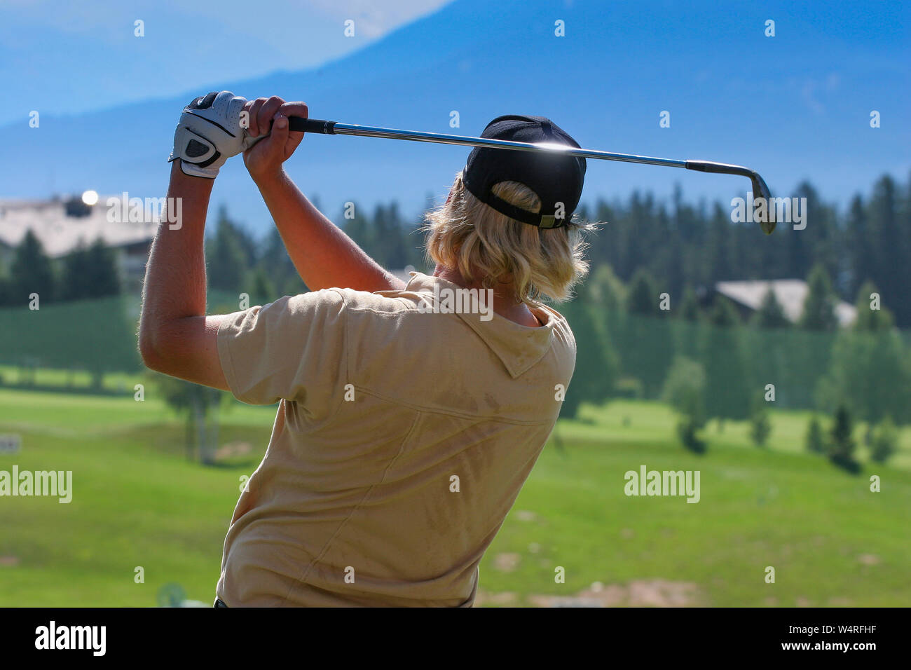 man golfer in action on a golf course Stock Photo - Alamy