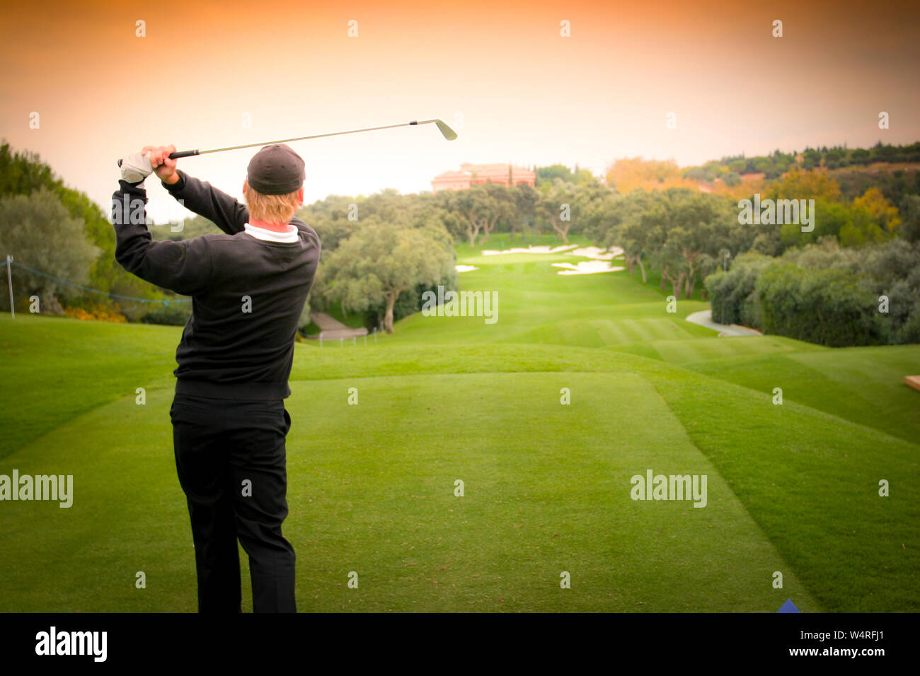man golfer in action on a golf course Stock Photo - Alamy