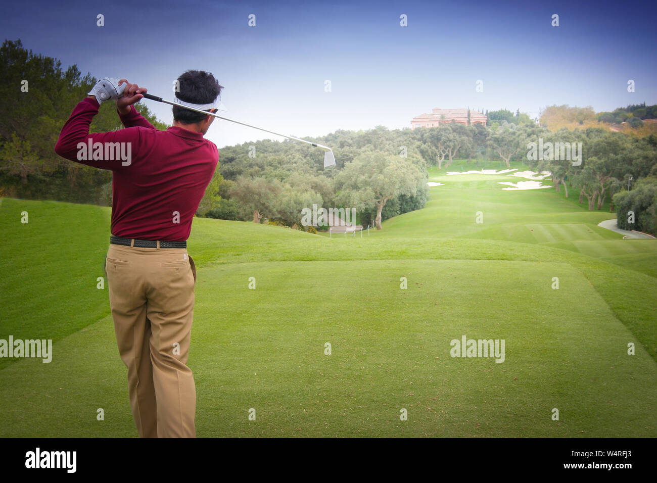 man golfer in action on a golf course Stock Photo - Alamy