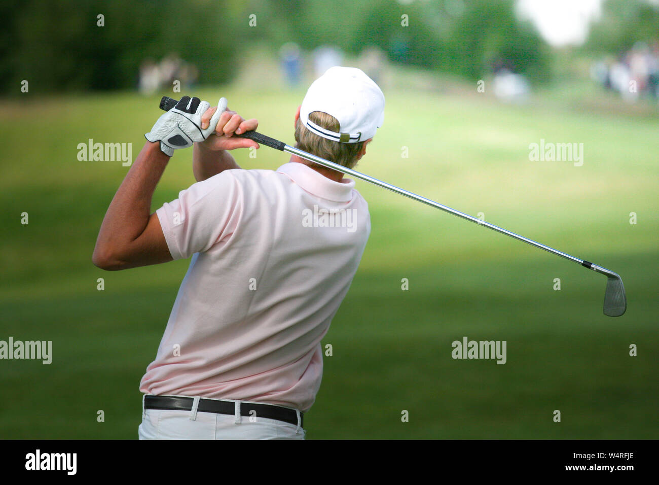man golfer in action on a golf course Stock Photo - Alamy