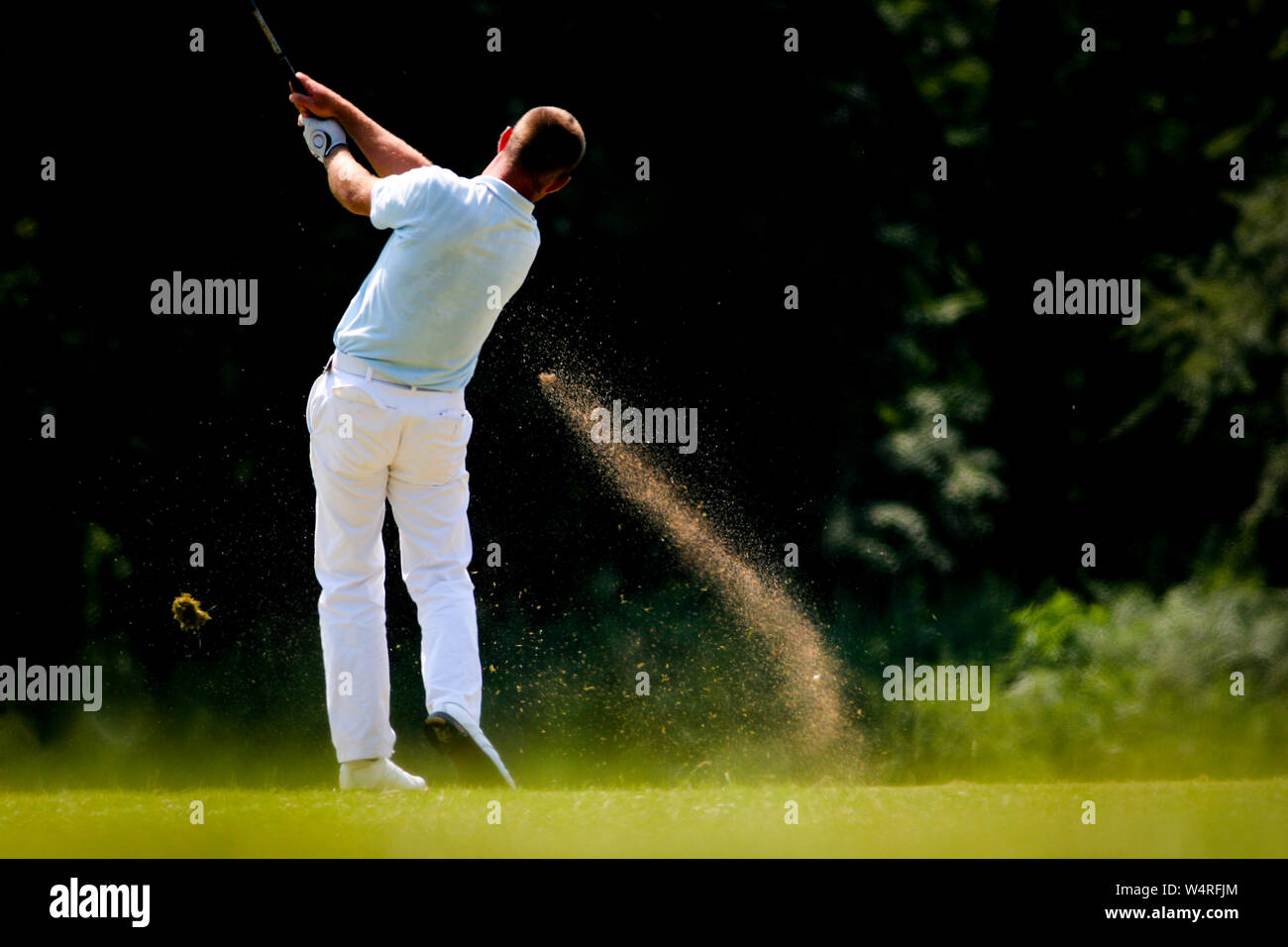 man golfer in action on a golf course Stock Photo - Alamy