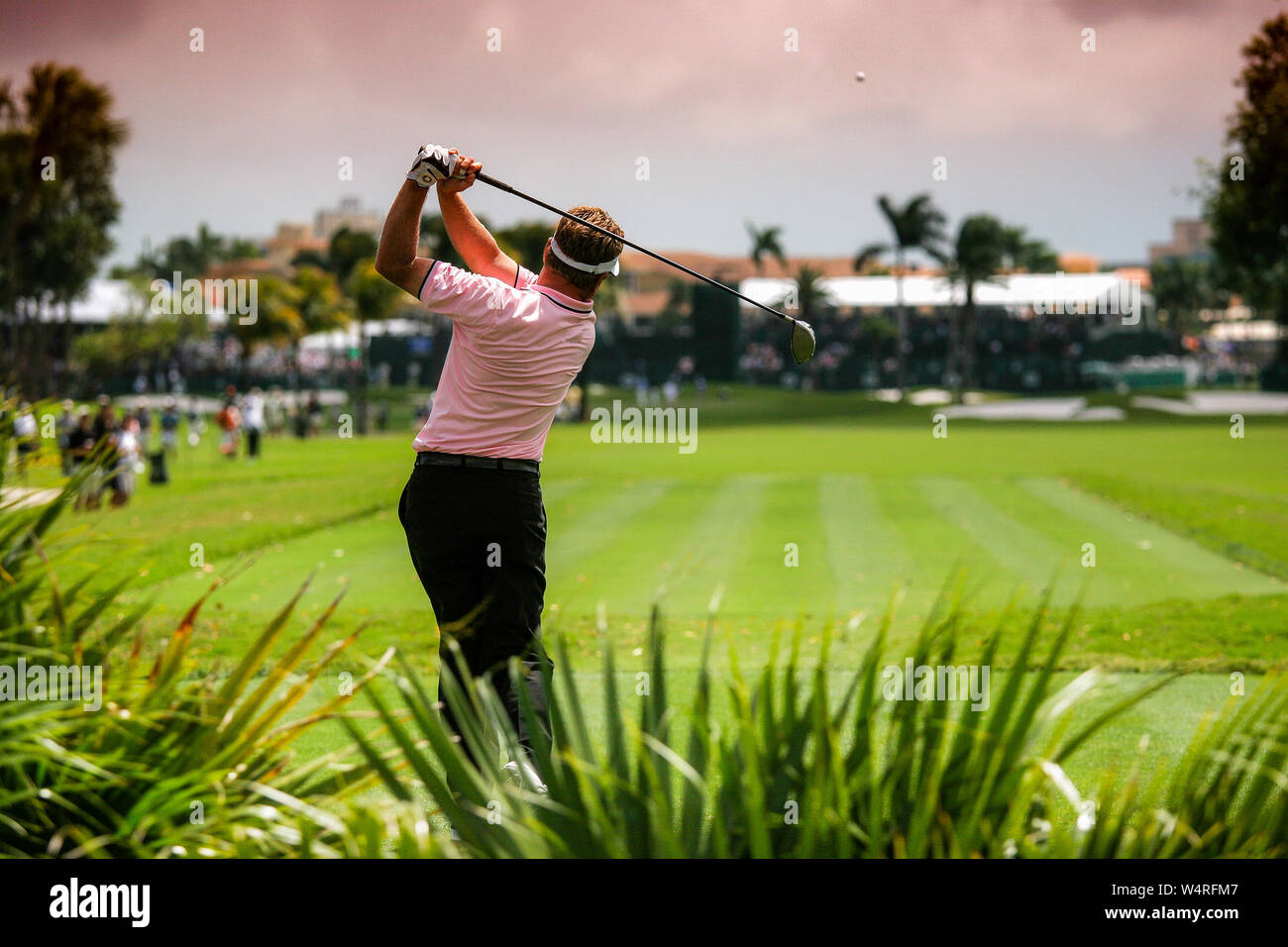 man golfer in action on a golf course Stock Photo - Alamy