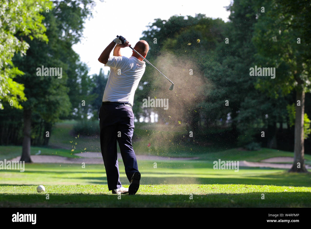 man golfer in action on a golf course Stock Photo - Alamy
