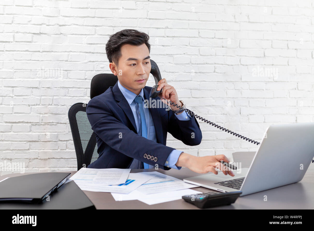 Man doing office work, Beijing, China Stock Photo - Alamy