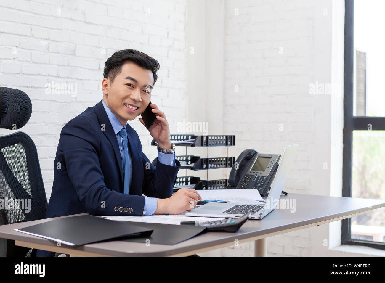 Man doing office work, Beijing, China Stock Photo - Alamy