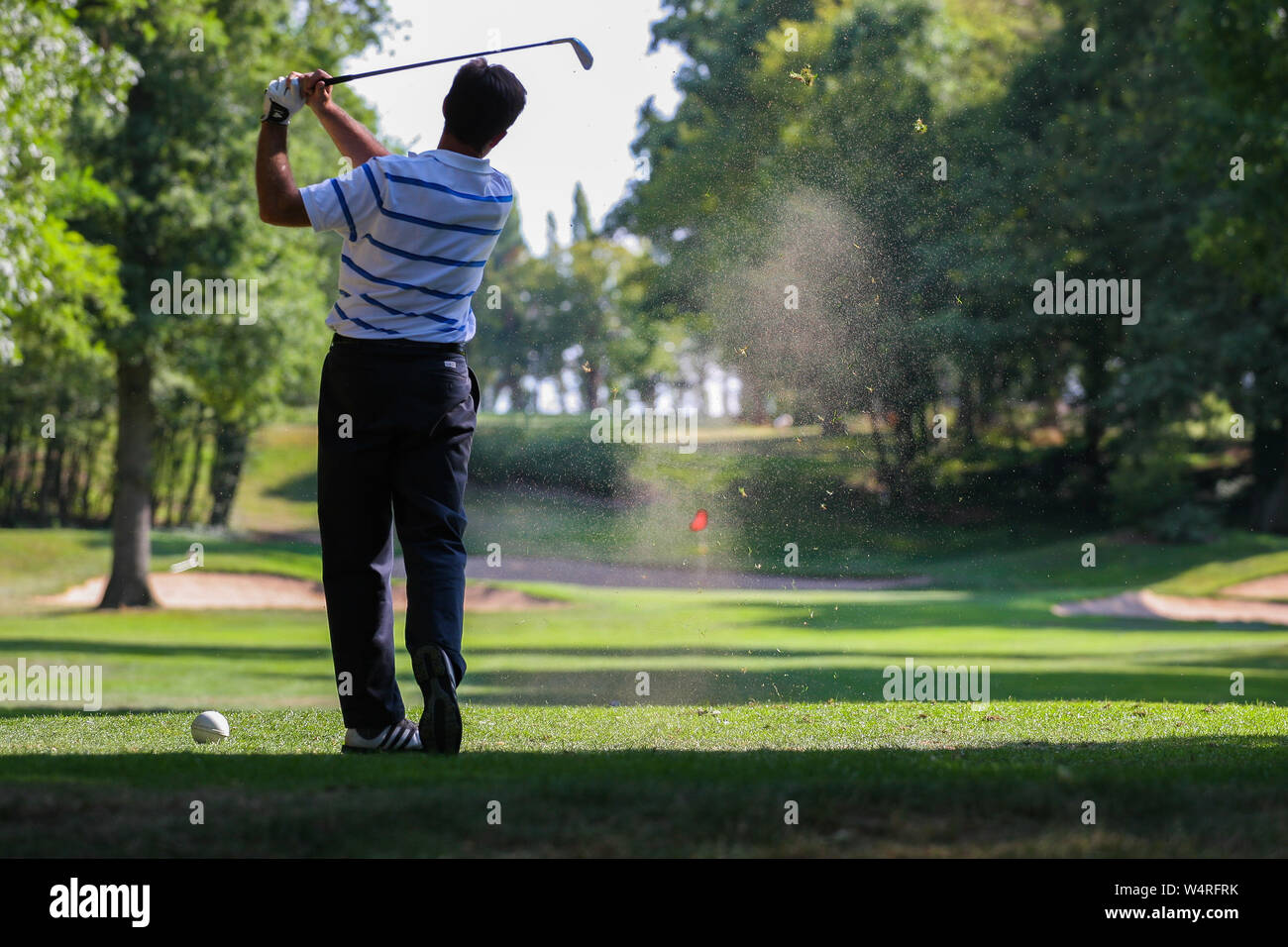 man golfer in action on a golf course Stock Photo - Alamy