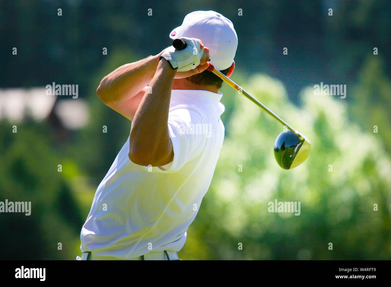 man golfer in action on a golf course Stock Photo - Alamy