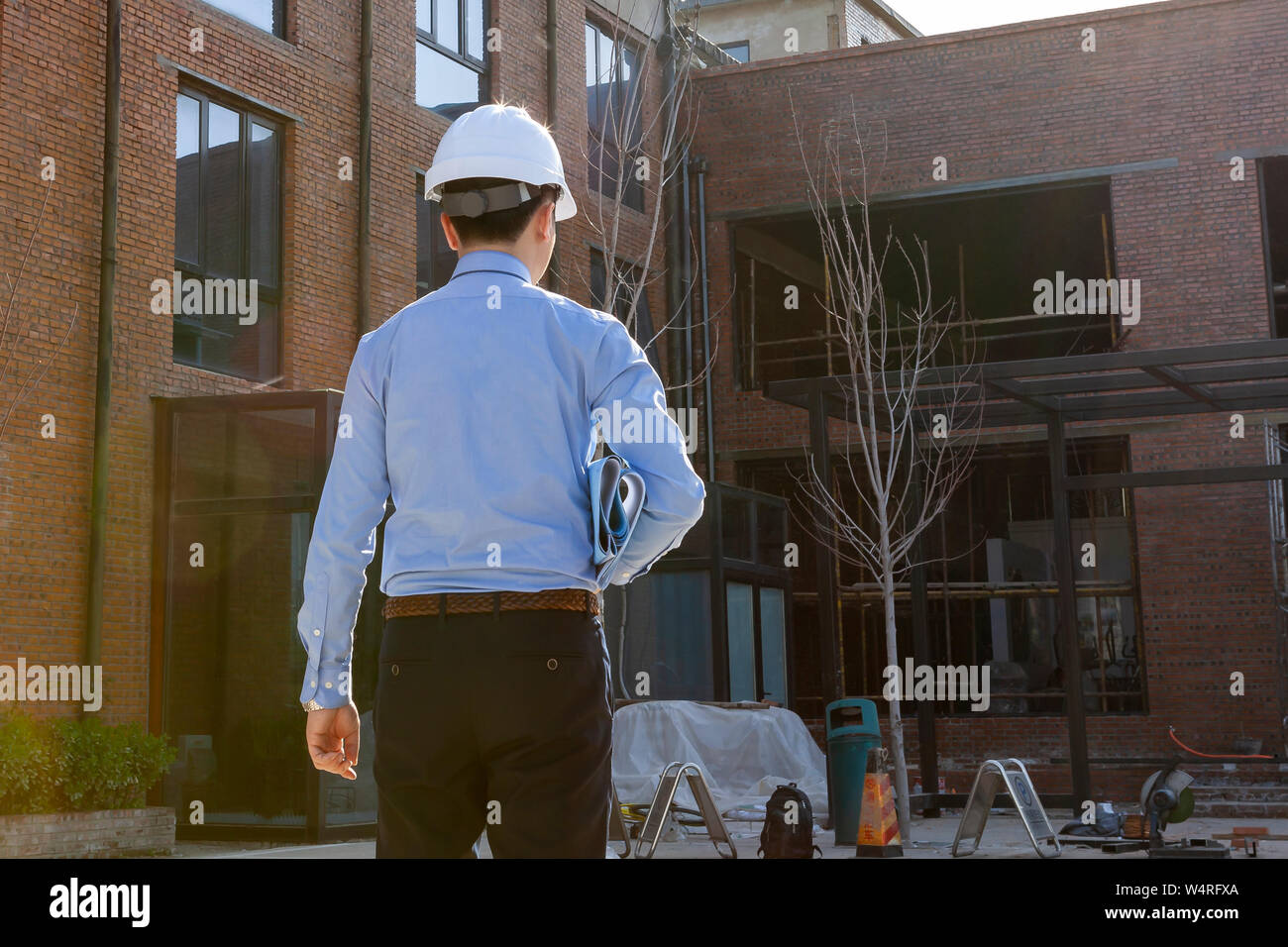 Male architect wearing safety helmet, Beijing, China Stock Photo - Alamy