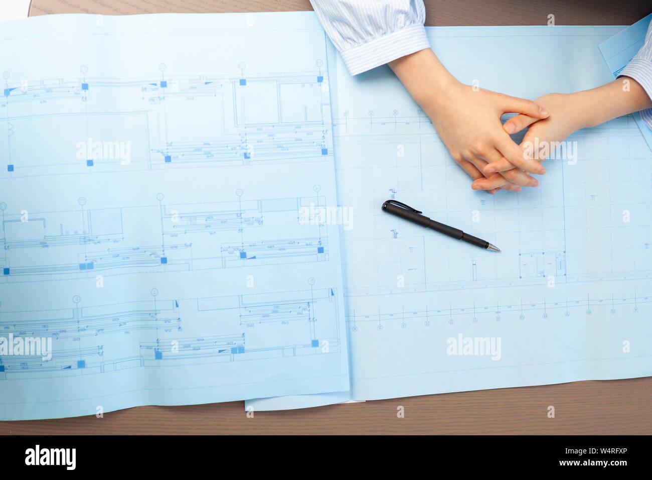 Blueprints and hands of female architect, Beijing, China Stock Photo ...