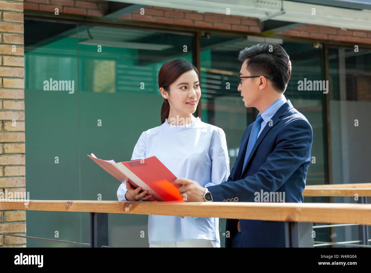 Employee having conversation with boss, Beijing, China Stock Photo - Alamy