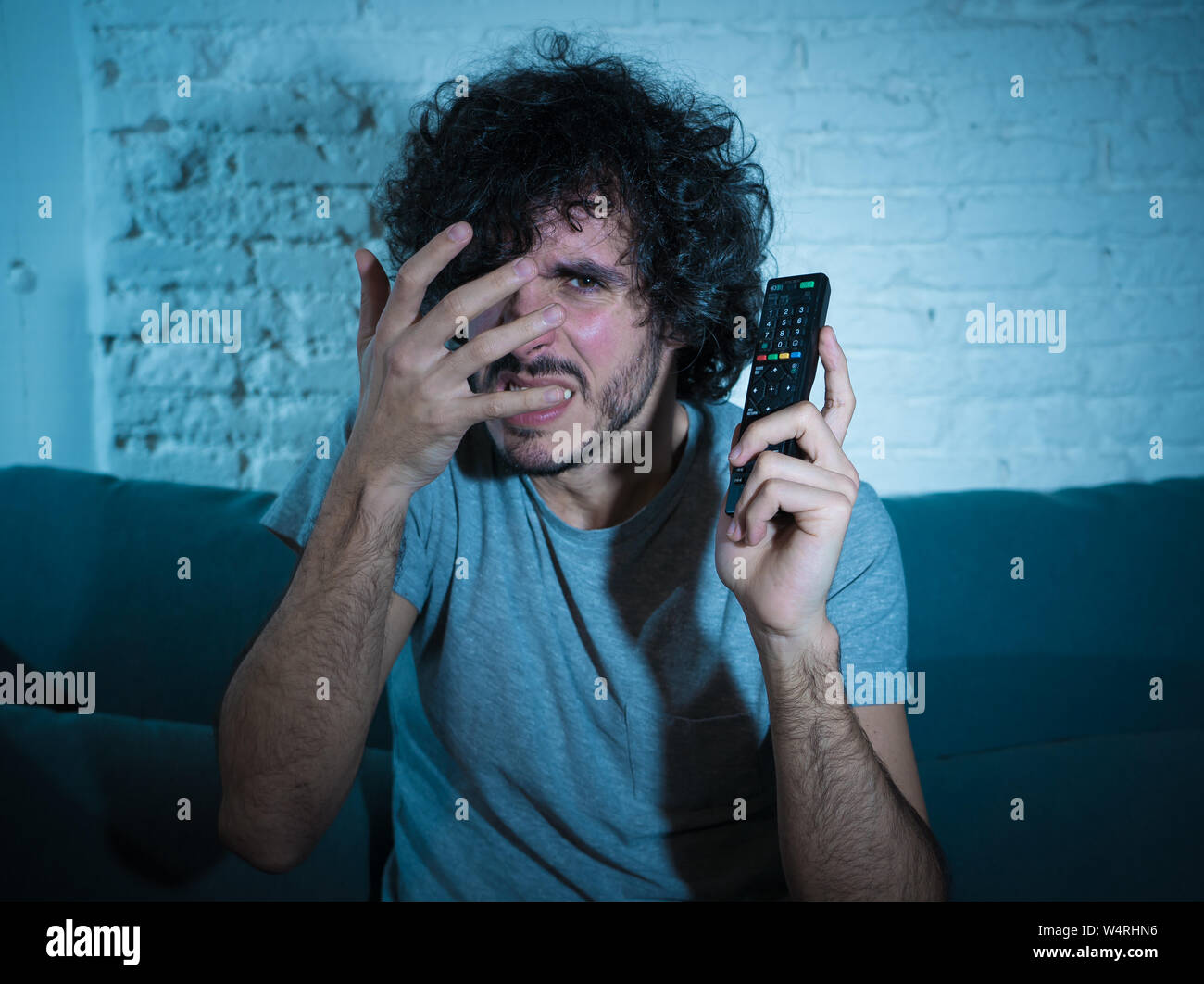 Lifestyle portrait of young man feeling scared and shocked making fear ...