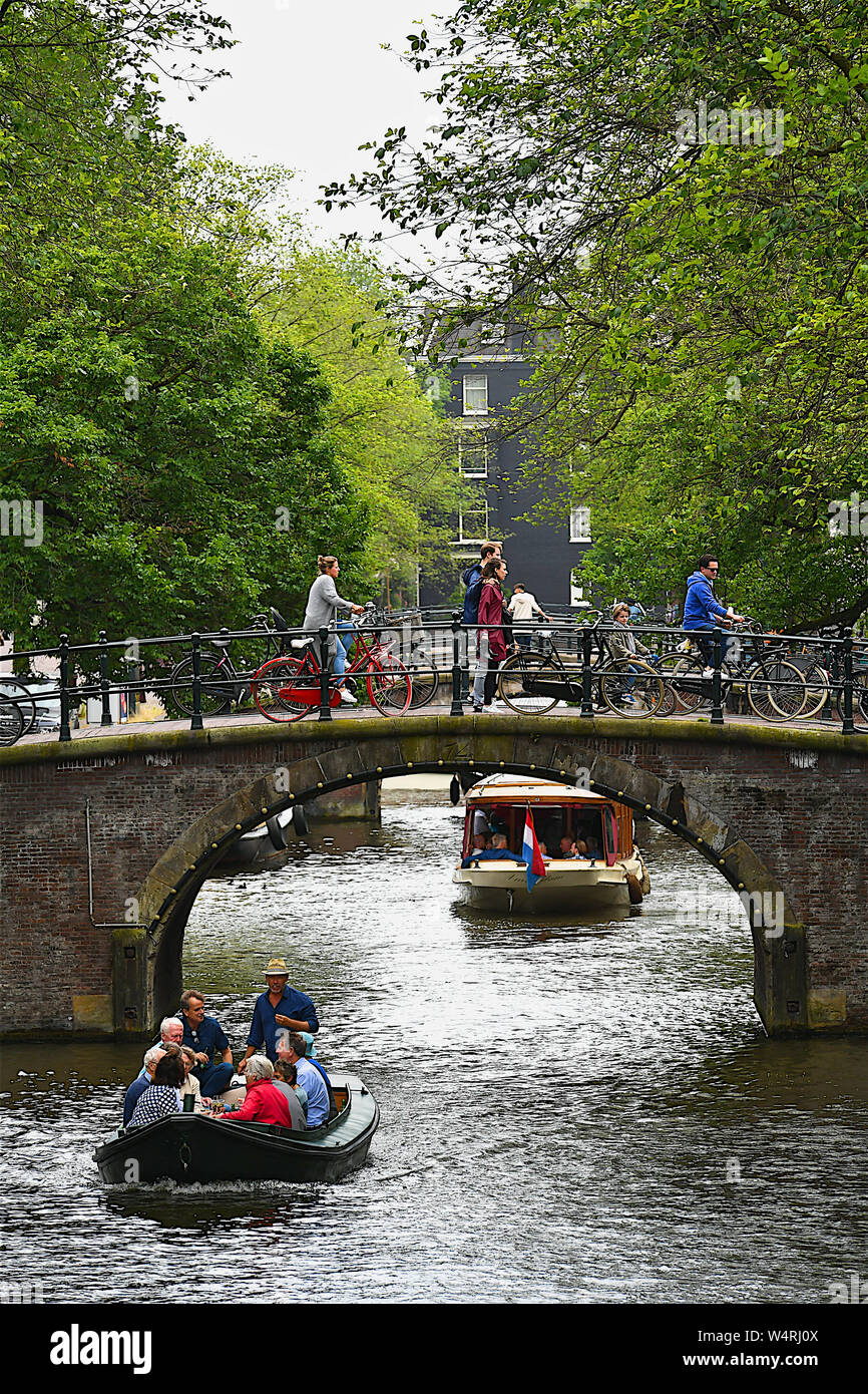 Arch bridge over city canal, Amsterdam, Netherlands Stock Photo - Alamy