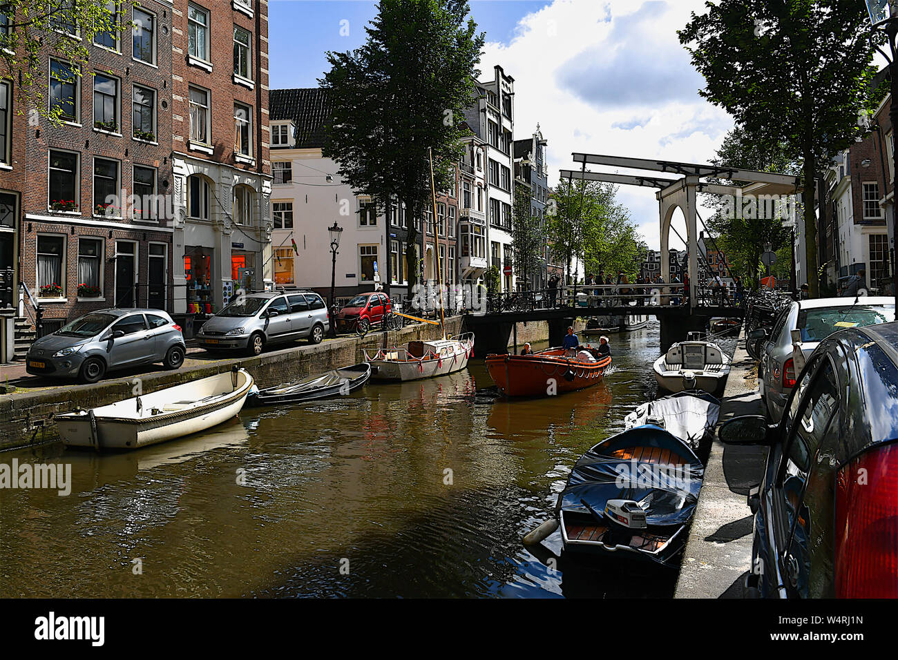 Boats on city canal, Amsterdam, Netherlands Stock Photo - Alamy