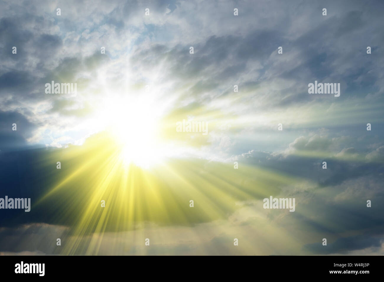 Sun rays sprouting through the clouds Paradise Stock Photo - Alamy