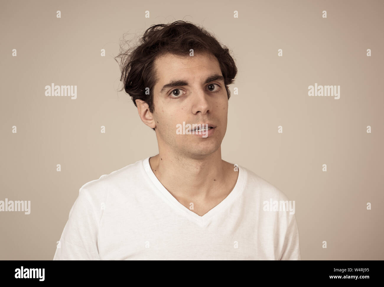 Close up portrait of young caucasian male with angry face. Looking ...