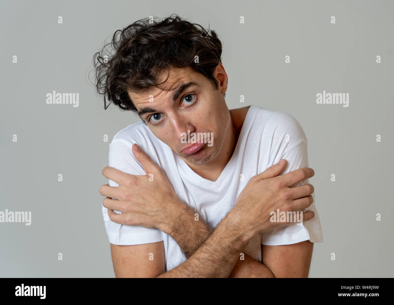 Portrait of young sad man crying in emotional pain looking desperate ...