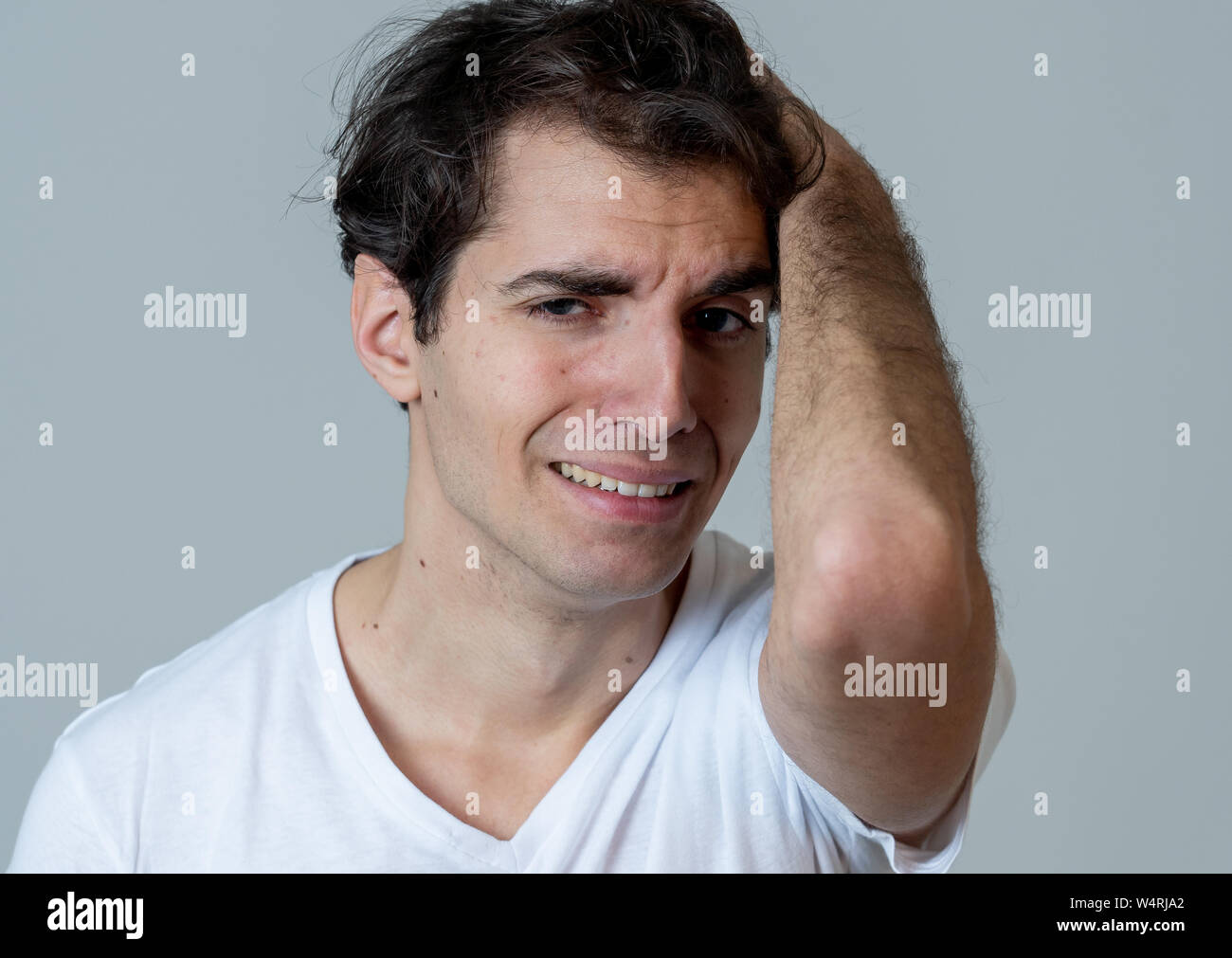 Portrait of young sad man crying in emotional pain looking desperate ...