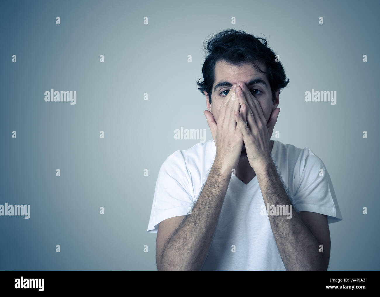 Close up portrait of young sensitive man feeling in love looking happy ...