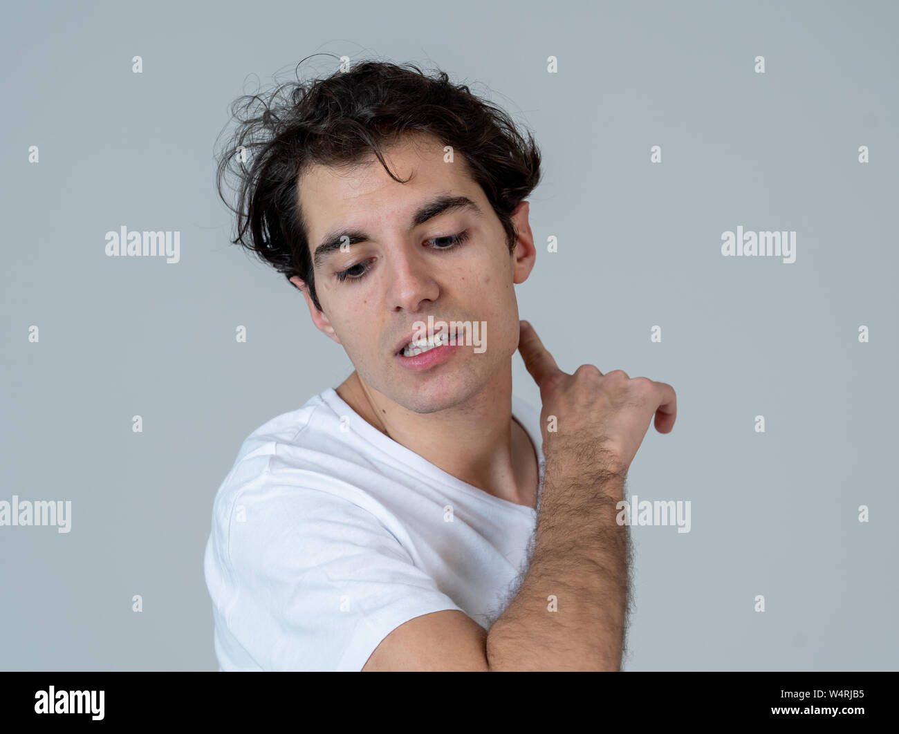 Close up portrait of young caucasian male with angry face. Looking ...