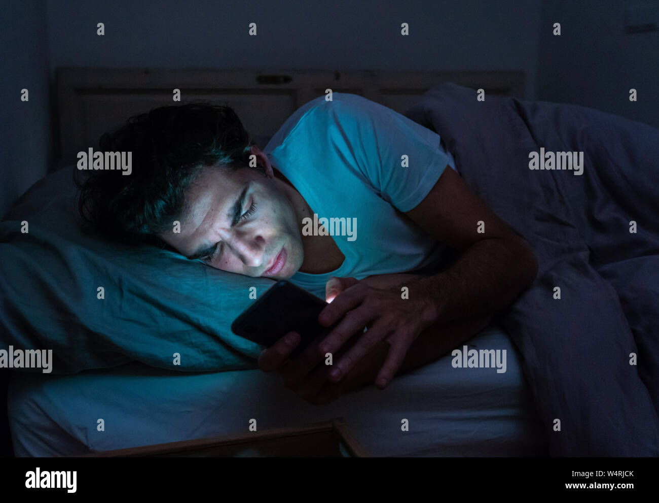 Male smart phone worried home hi-res stock photography and images - Alamy