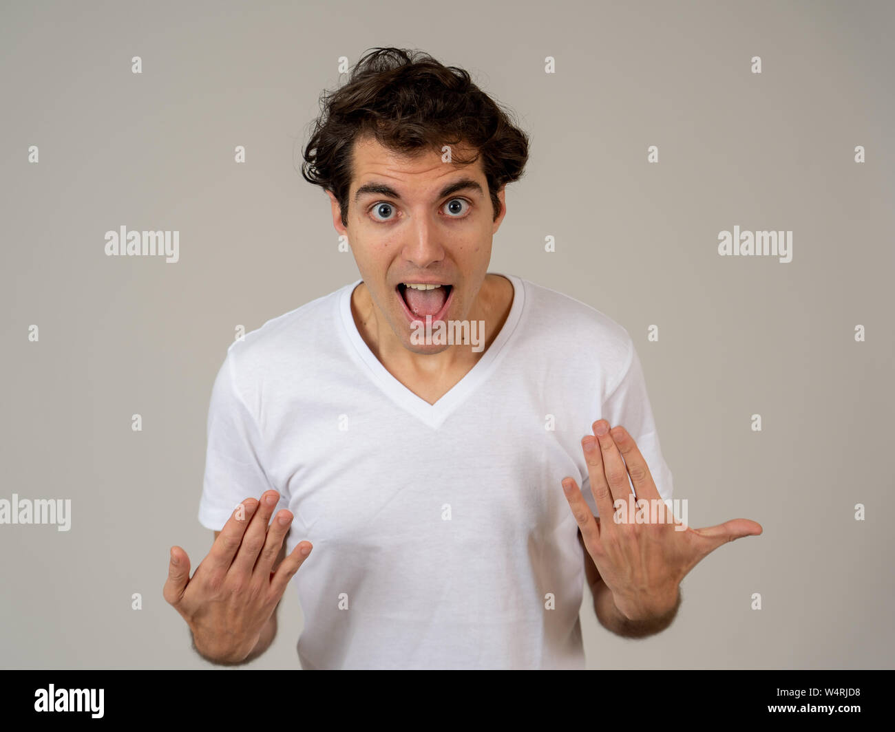 Portrait of Amazed excited funny Man achieving his goal or wining ...