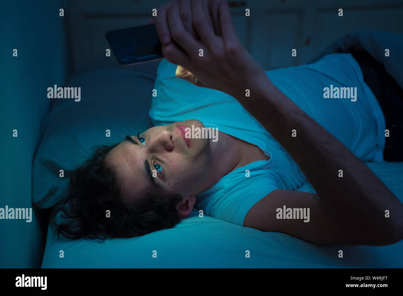 Man phone night bedtime hi-res stock photography and images - Alamy