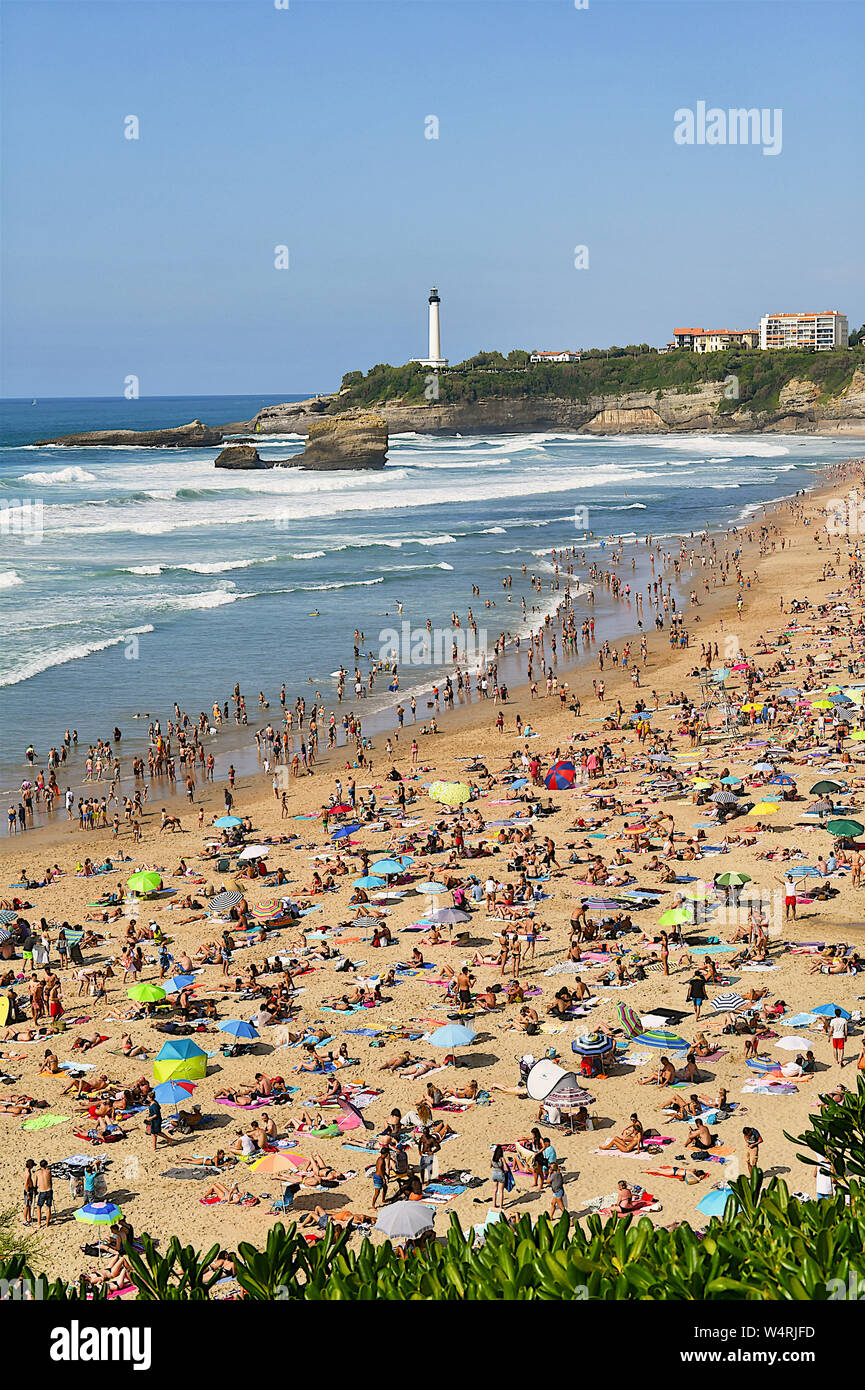 Seascape and beach full of people in Biarritz, Basque Country, France ...