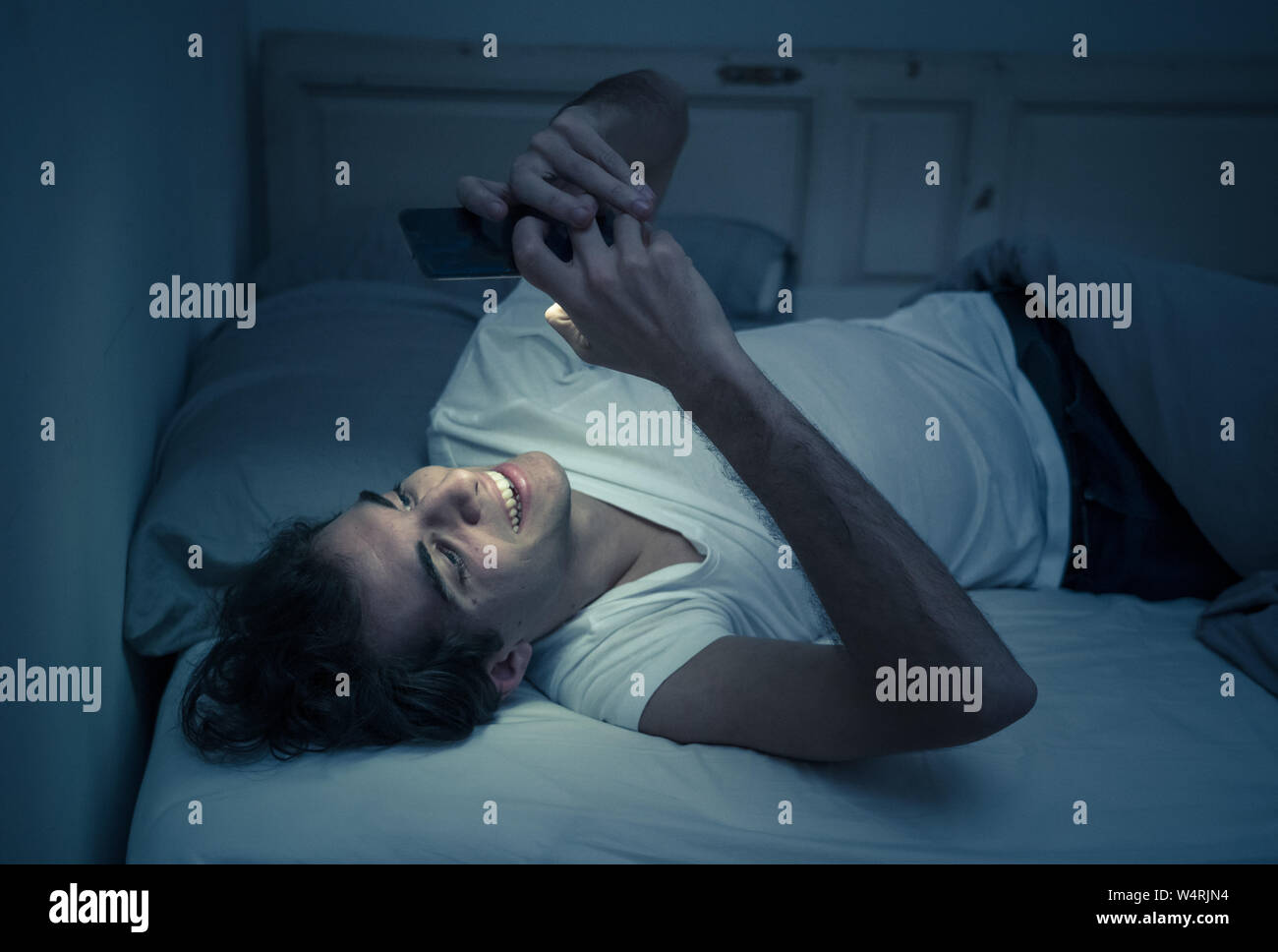 Man phone night bedtime hi-res stock photography and images - Alamy