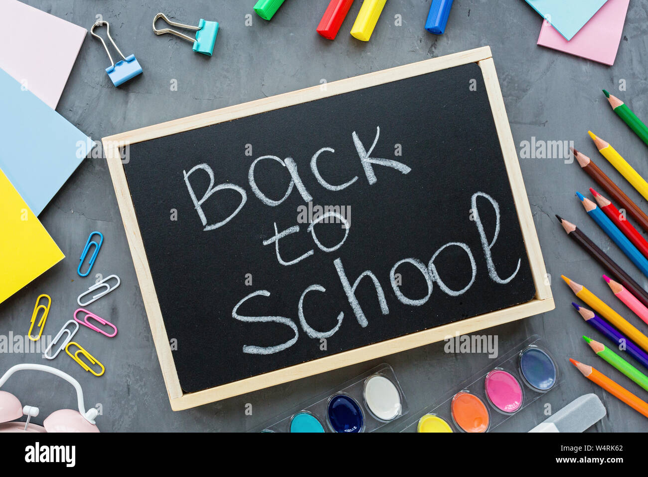 back to school flat lay with bright stationery. School supplies for ...