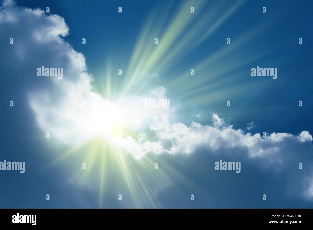 Sun rays sprouting through the clouds Paradise Stock Photo - Alamy