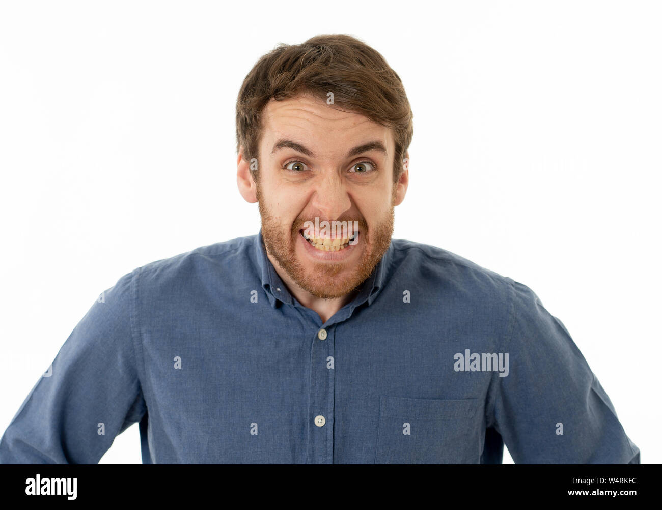 Portrait of funny attractive young man with happy and surprised face ...