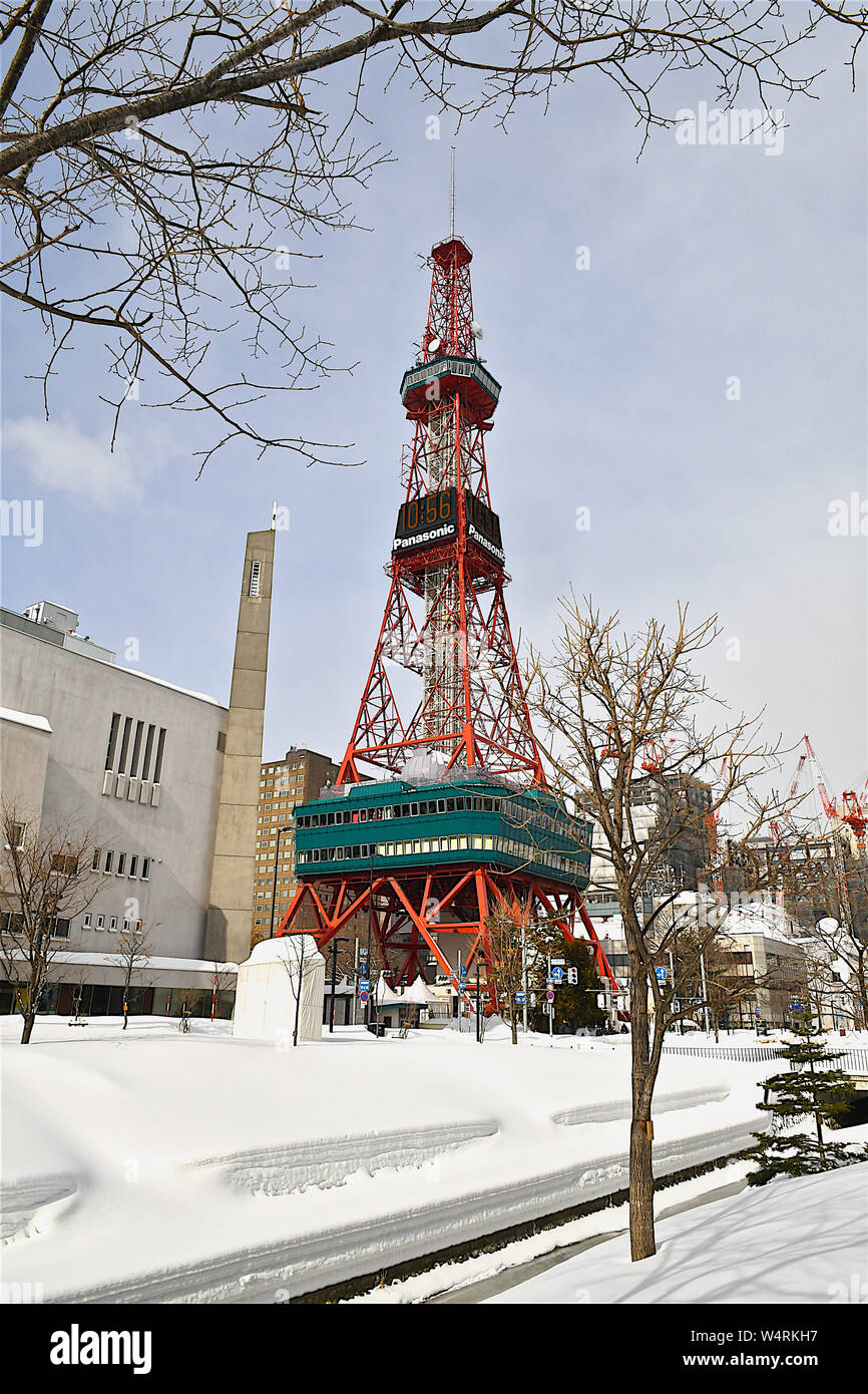 View of TV tower and ground covered in thick layer of snow in winter ...