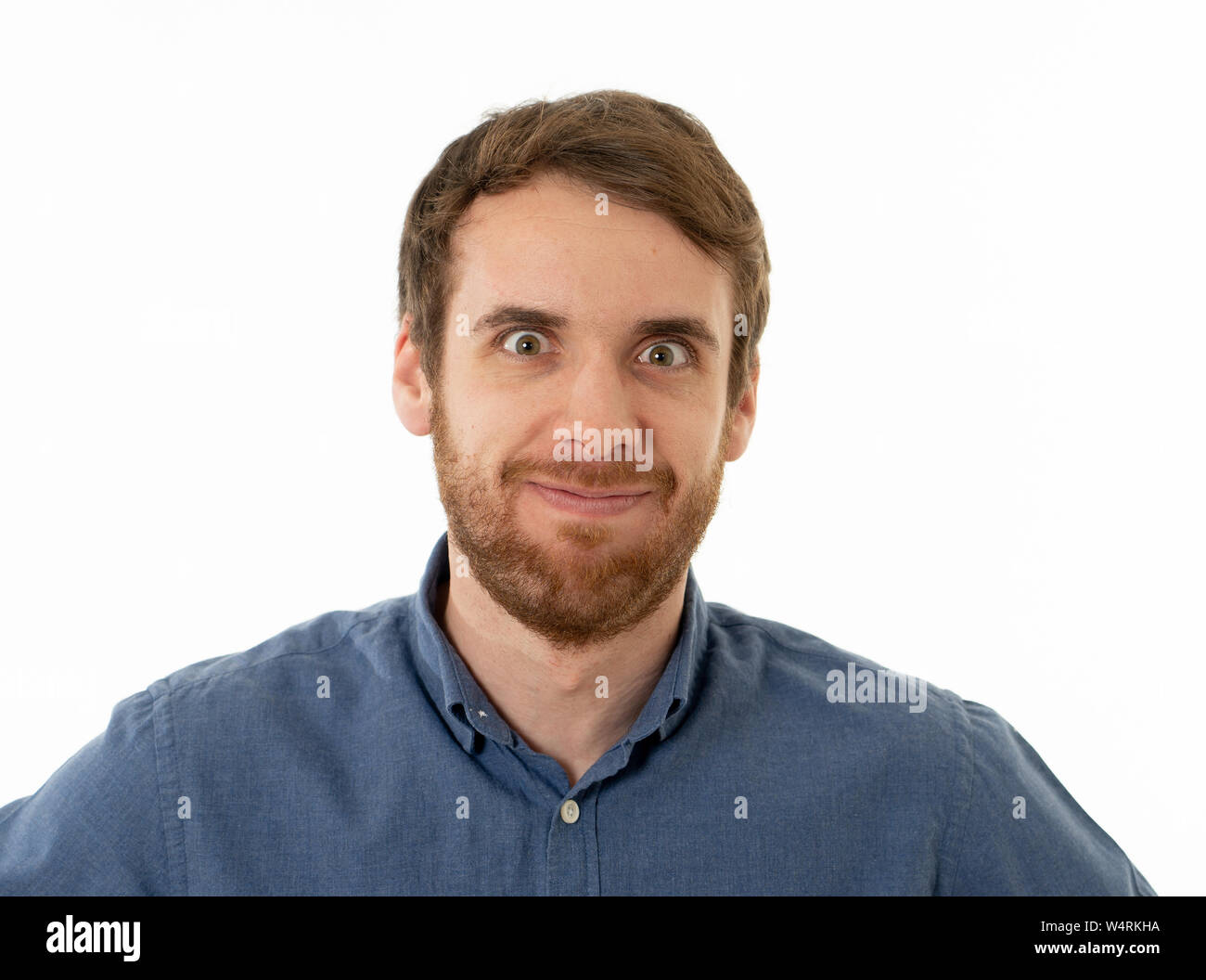 Portrait of funny attractive young man with happy and surprised face ...
