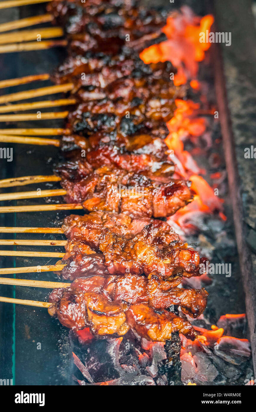 Lamb shashliks cooking over barbecue grill, Ubud, Bali, Indonesia Stock ...