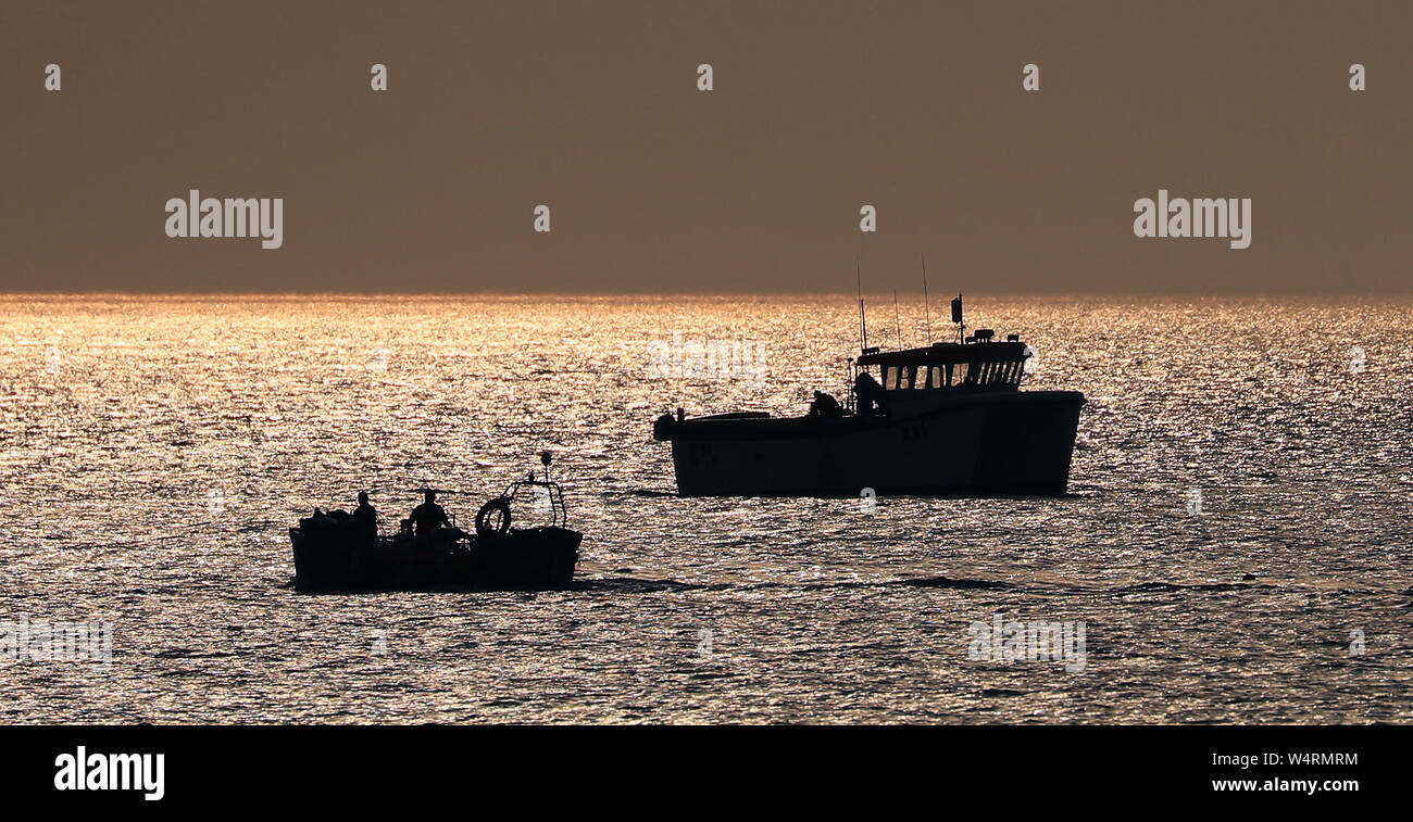 Fishing boats out early in the Channel near Dover, Kent, as the UK ...