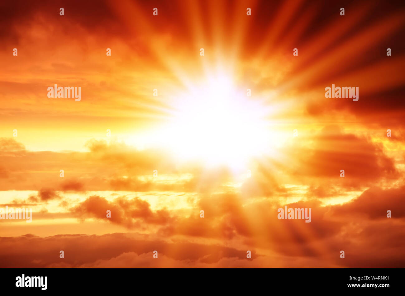 Red sunset, rich dark clouds, rays of light Stock Photo - Alamy