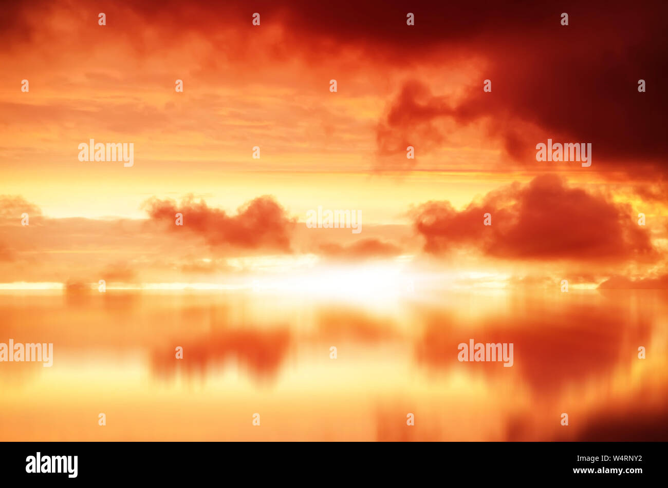 Red sunset over sea, rich dark clouds, Bright sun rays Stock Photo - Alamy