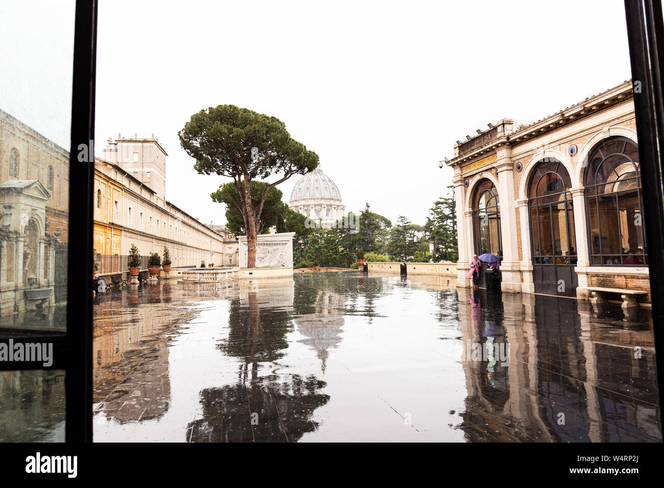 ROME, ITALY - JUNE 28, 2019: people under rain in square near old ...