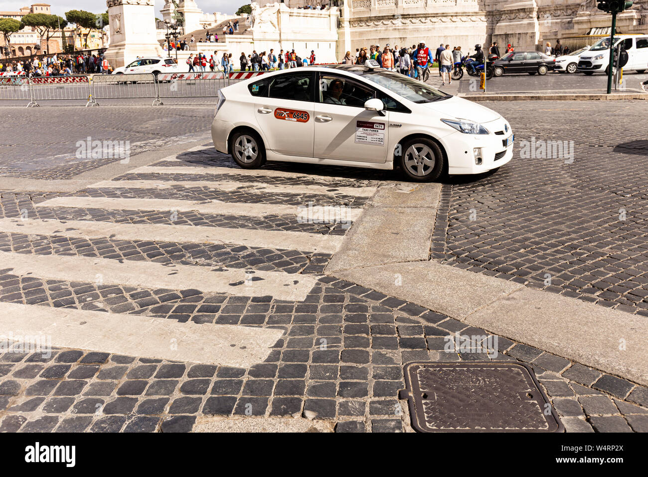 ROME, ITALY - JUNE 28, 2019: crowd of people and cars on pavement in ...