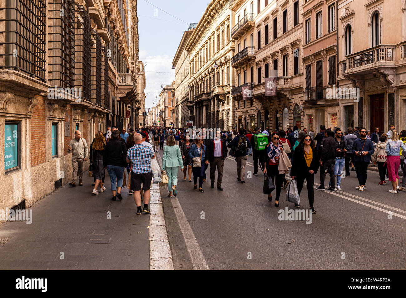 ROME, ITALY - JUNE 28, 2019: crowd of people walking on street near old ...