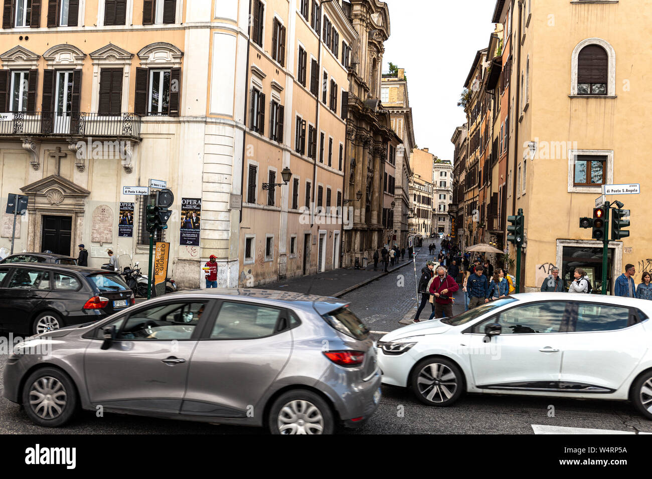 ROME, ITALY - JUNE 28, 2019: crowd of people and cars on street near ...